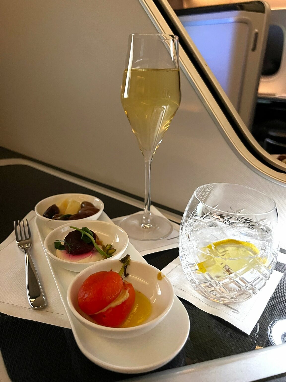 British Airways First class versus Qatar Business class QSuite ...